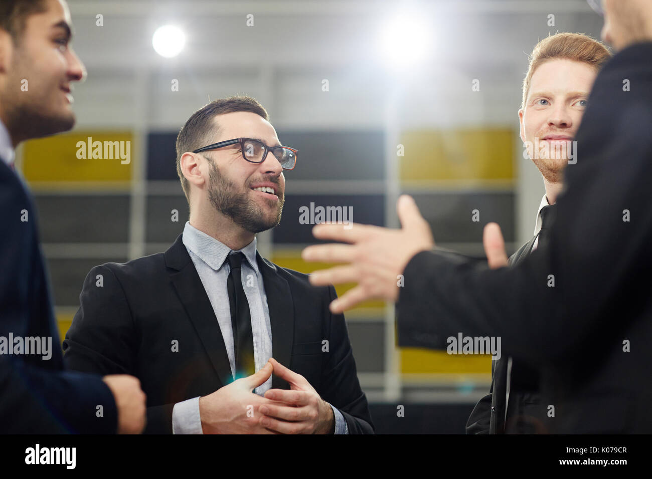 Cheerful Businessmen Having Small Talk Stock Photo - Alamy