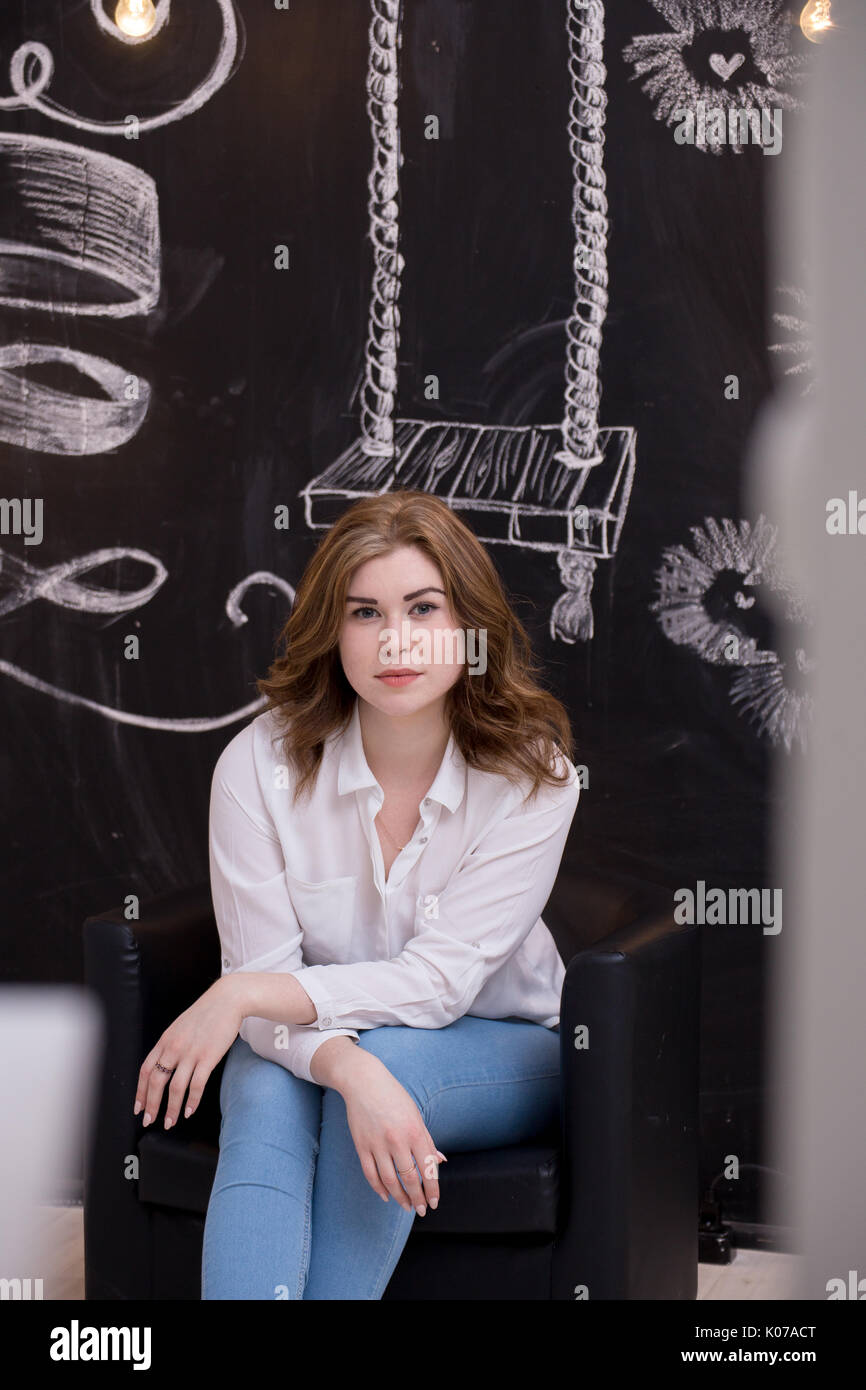 Charming young girl on a studio photo shoot Stock Photo - Alamy