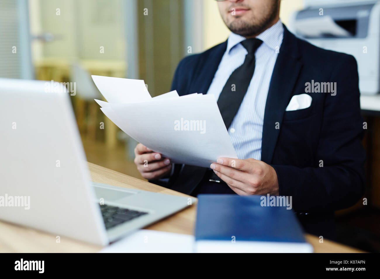Businessman reading financial documents hi-res stock photography and ...