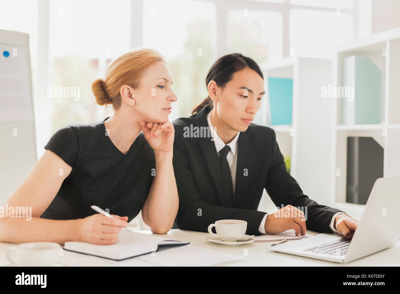 Sharing Ideas with Coworker Stock Photo - Alamy