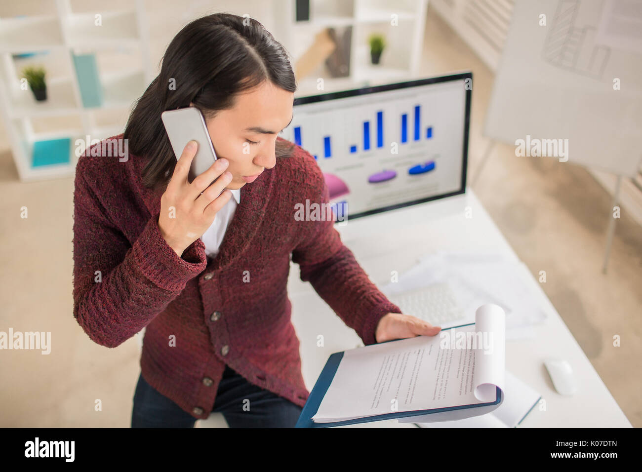 Asian office worker using smartphone hi-res stock photography and ...