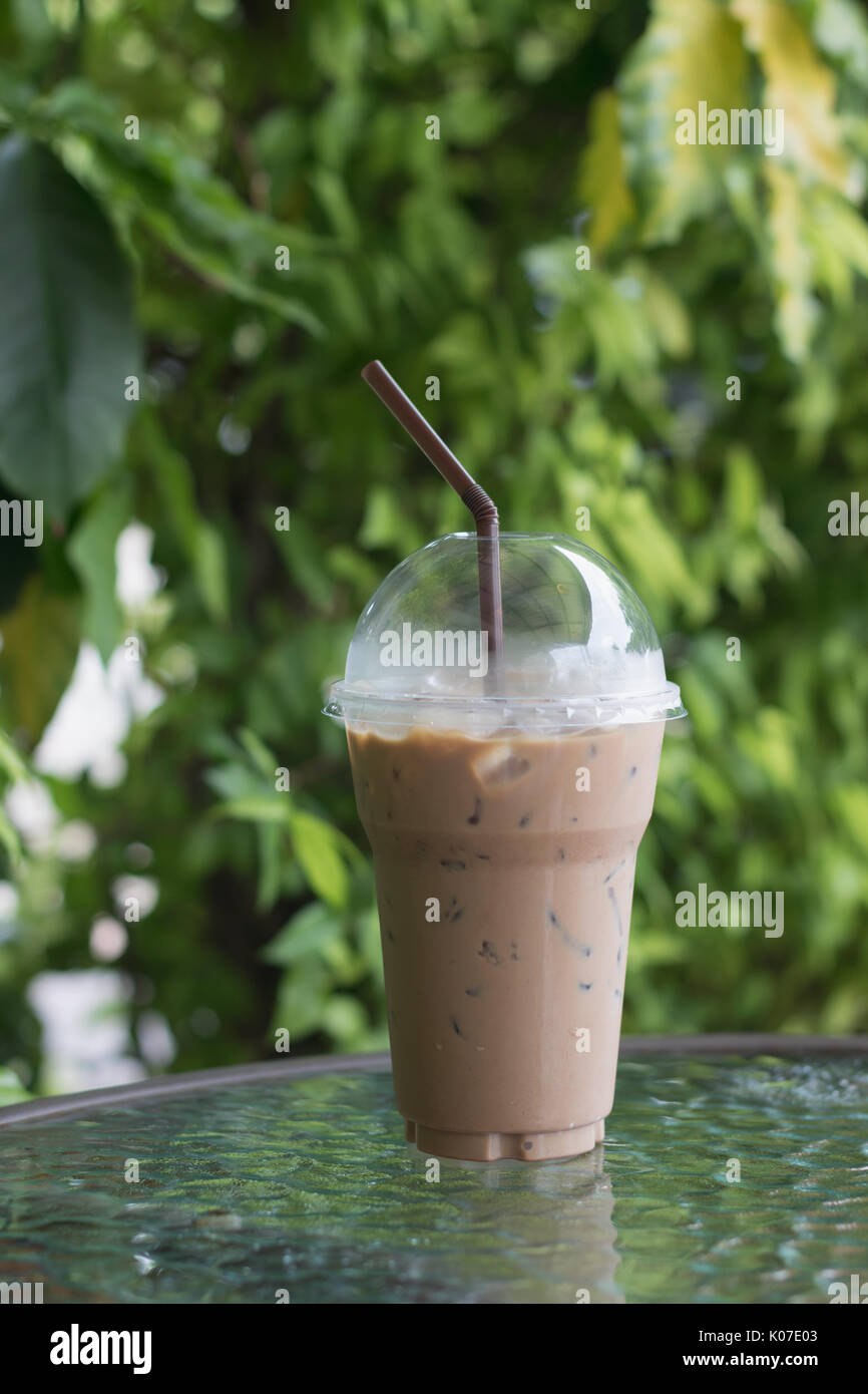 Iced coffee in take away cup (plastic glass) on the table in cafe Stock ...