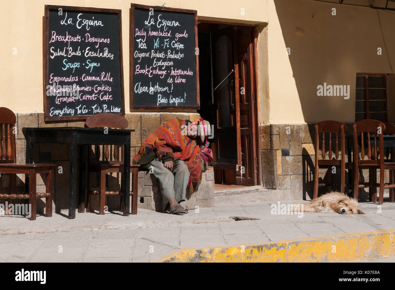An old man wearing traditional Quechua clothing, 'chullo' hat and ...