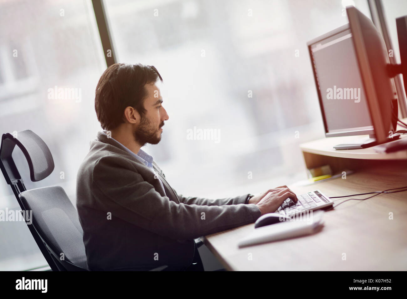 Technology office young computer hi-res stock photography and images ...