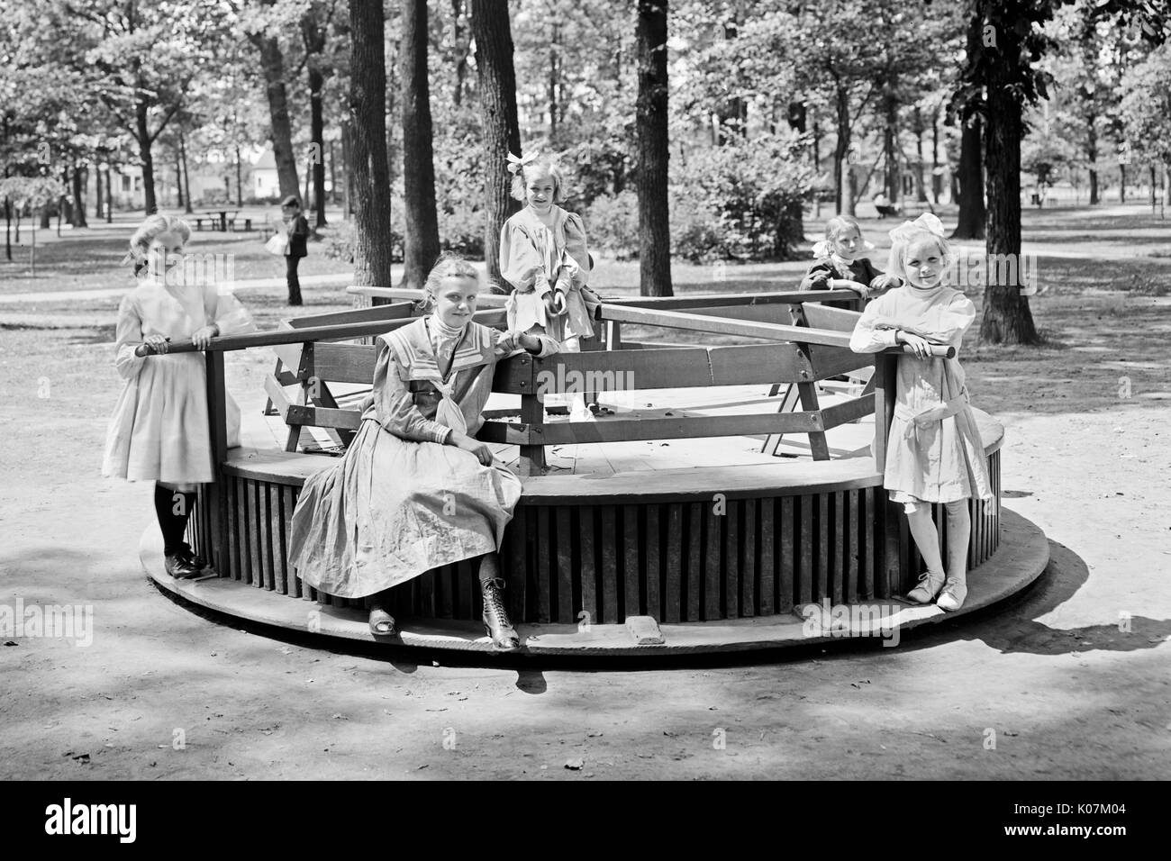Children riding a Merry-go-round roundabout in Clark Park, D Stock ...