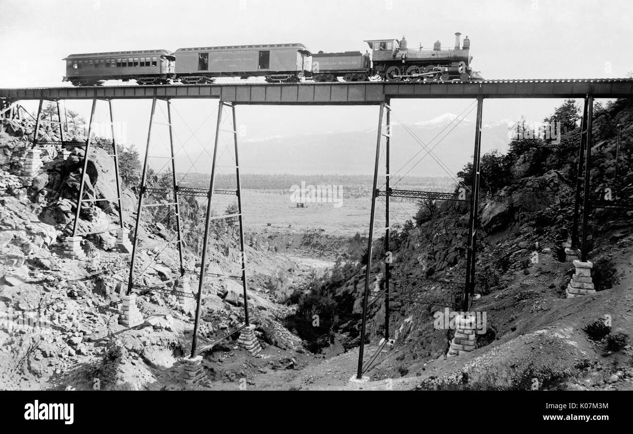 A railway train crossing the high bridge near Buena Vista, Colorado ...