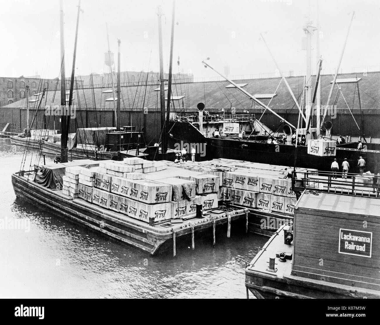 A freighter ship loading Ford Motor Cars as cargo at the doc Stock ...