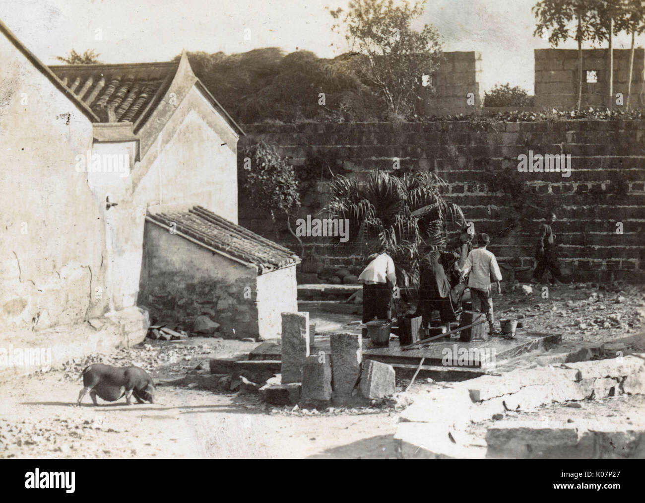 People working in a back yard, China Stock Photo - Alamy