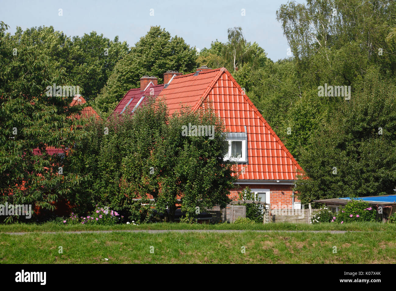 Residential House with green trees Stock Photo - Alamy