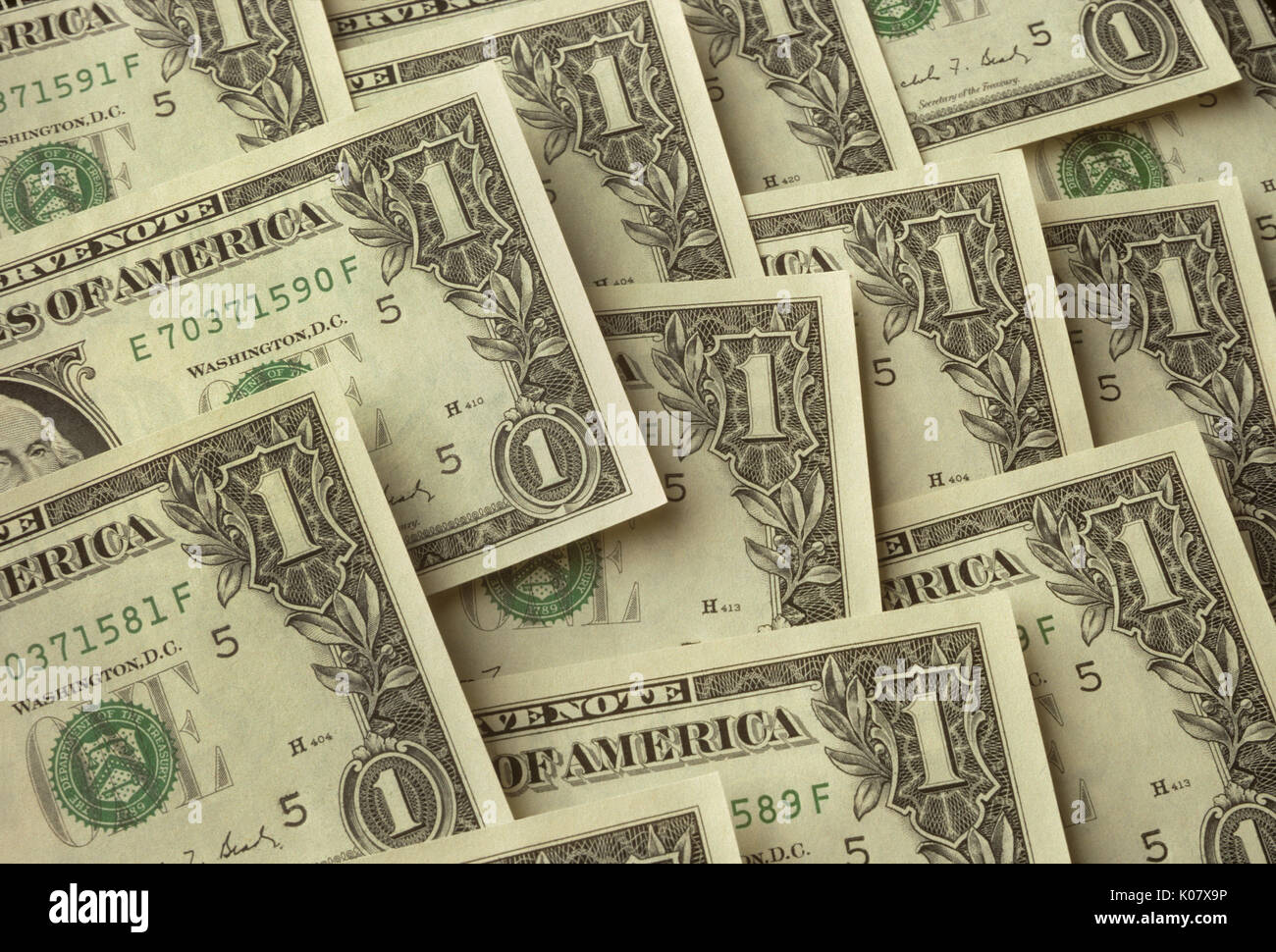 One-dollar bills lying on one another Stock Photo - Alamy