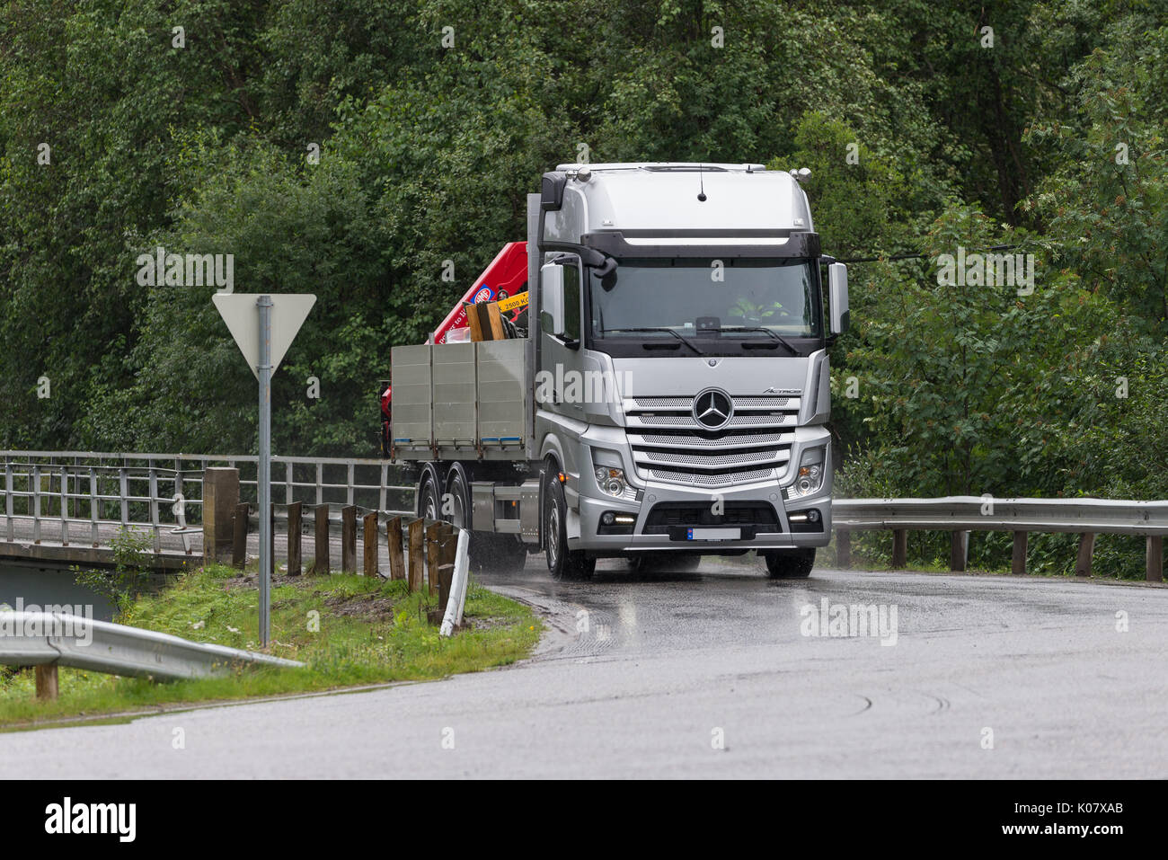European truck drive over a small bridge Stock Photo - Alamy