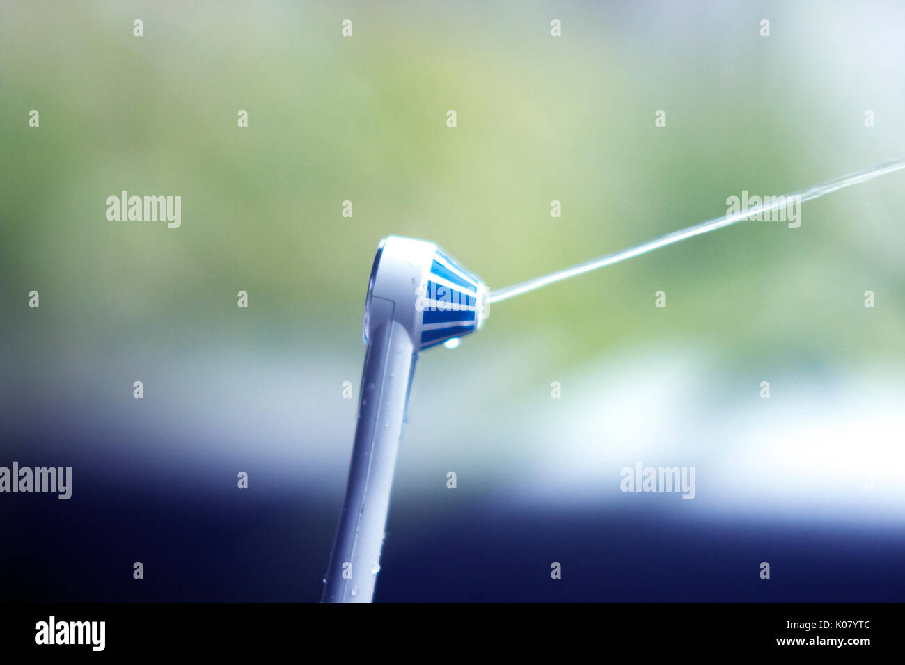 Dental water spray cleaner for interdental hygiene Stock Photo - Alamy