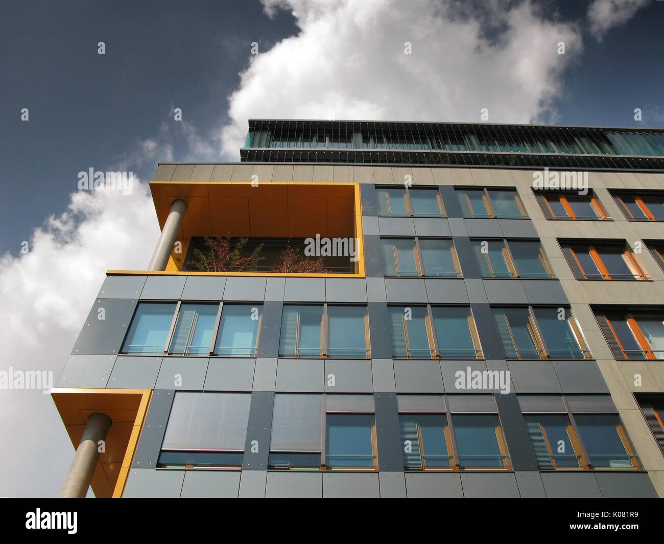 Yellow design building Stock Photo - Alamy