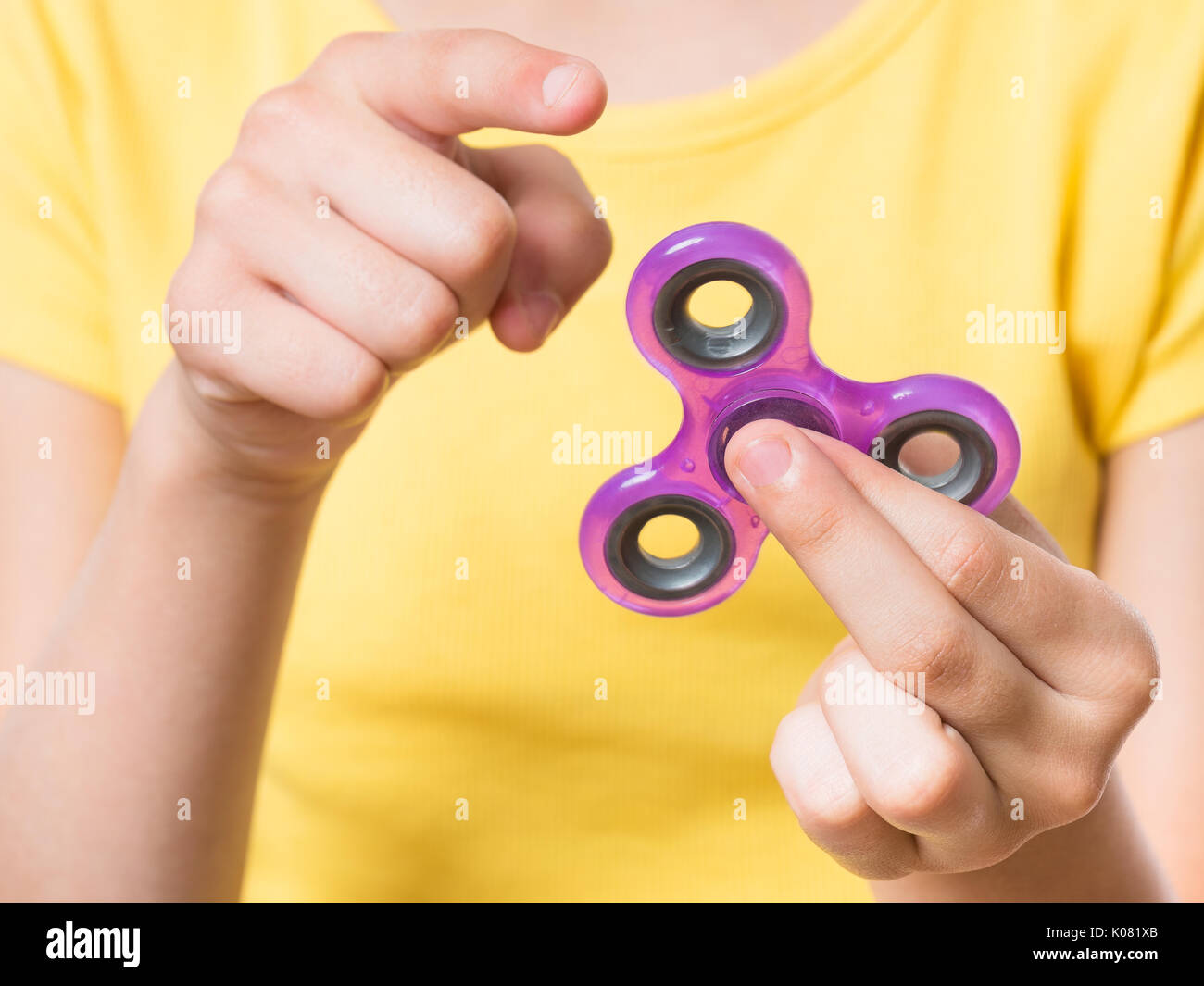 Hand with spinner Stock Photo - Alamy