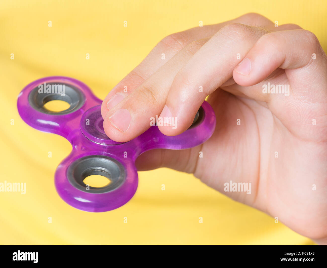 Hand with spinner Stock Photo - Alamy