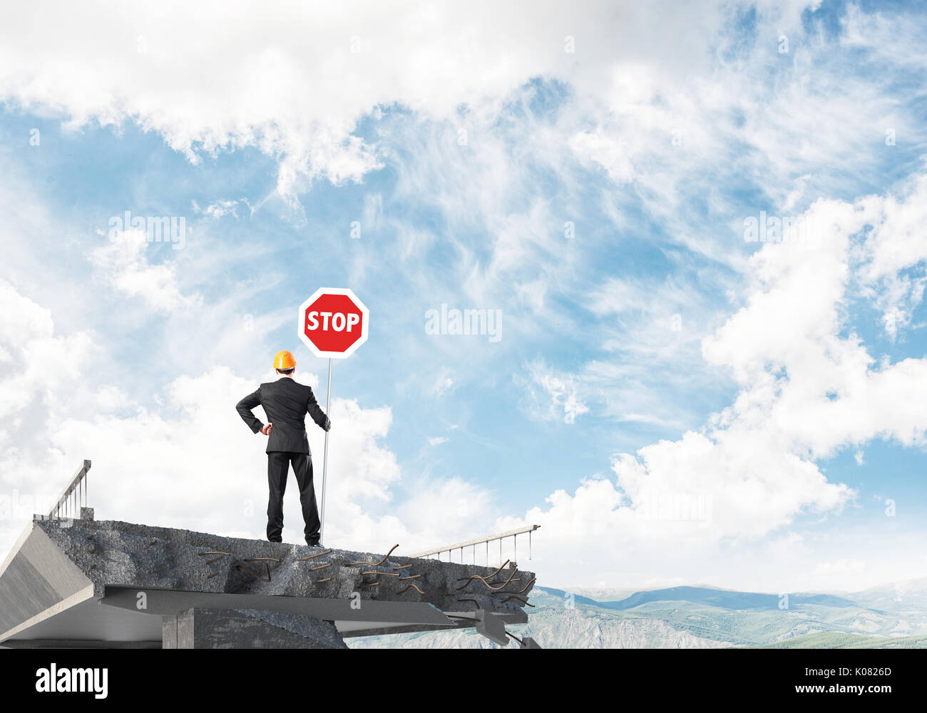 Confident engineer holding street safety sign Stock Photo - Alamy