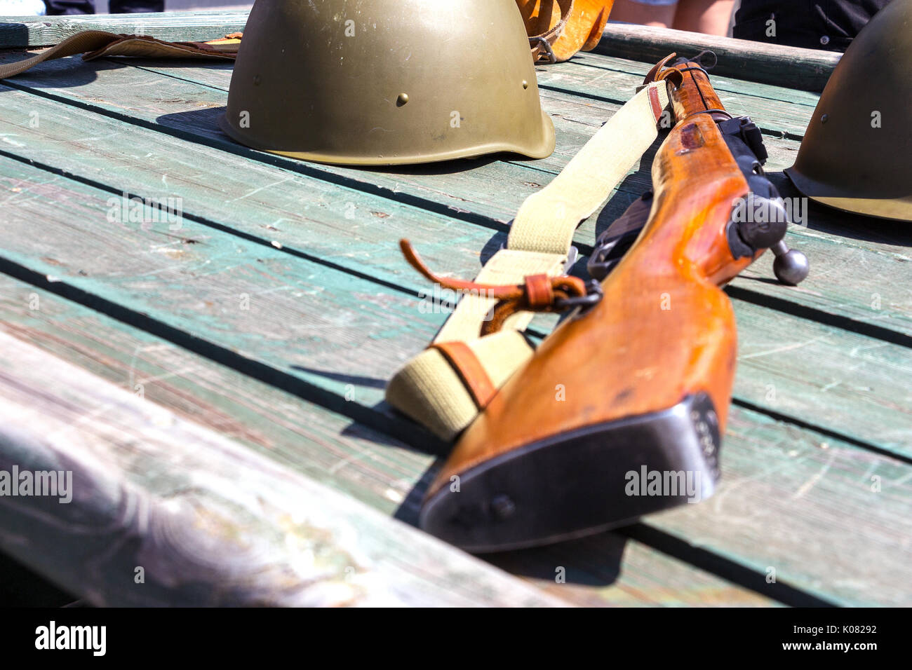 Old military helmet and rifle Stock Photo - Alamy
