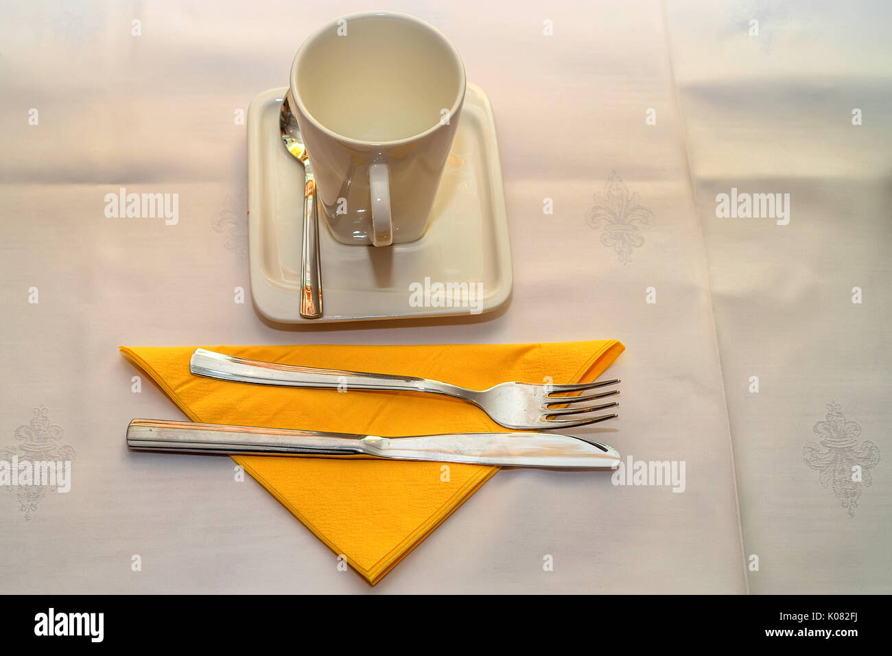 Table setting on white background Stock Photo - Alamy
