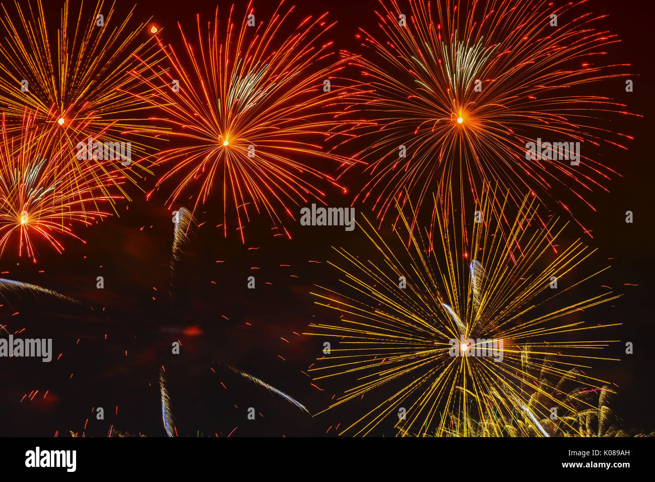 Bright golden glowing spheres and flickering stars, fireworks. Elegant ...