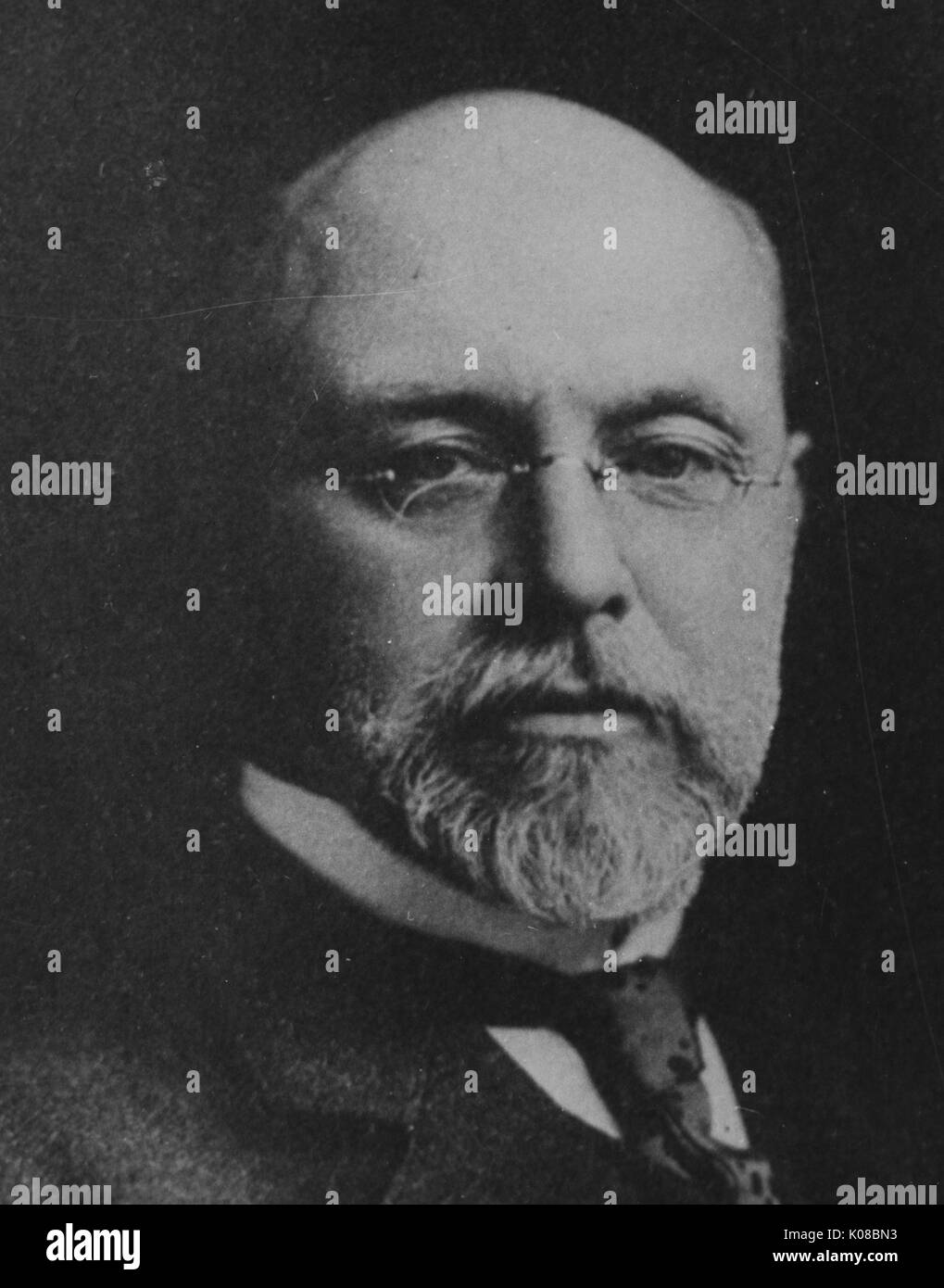 Close up shot of Ira Remsen, bearded, wearing glasses, neutral facial ...