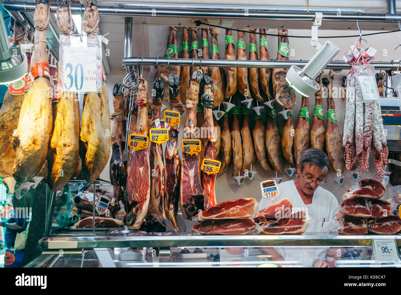 Iberico ham Jamon and charcuterie shop at La Boqueria market in ...