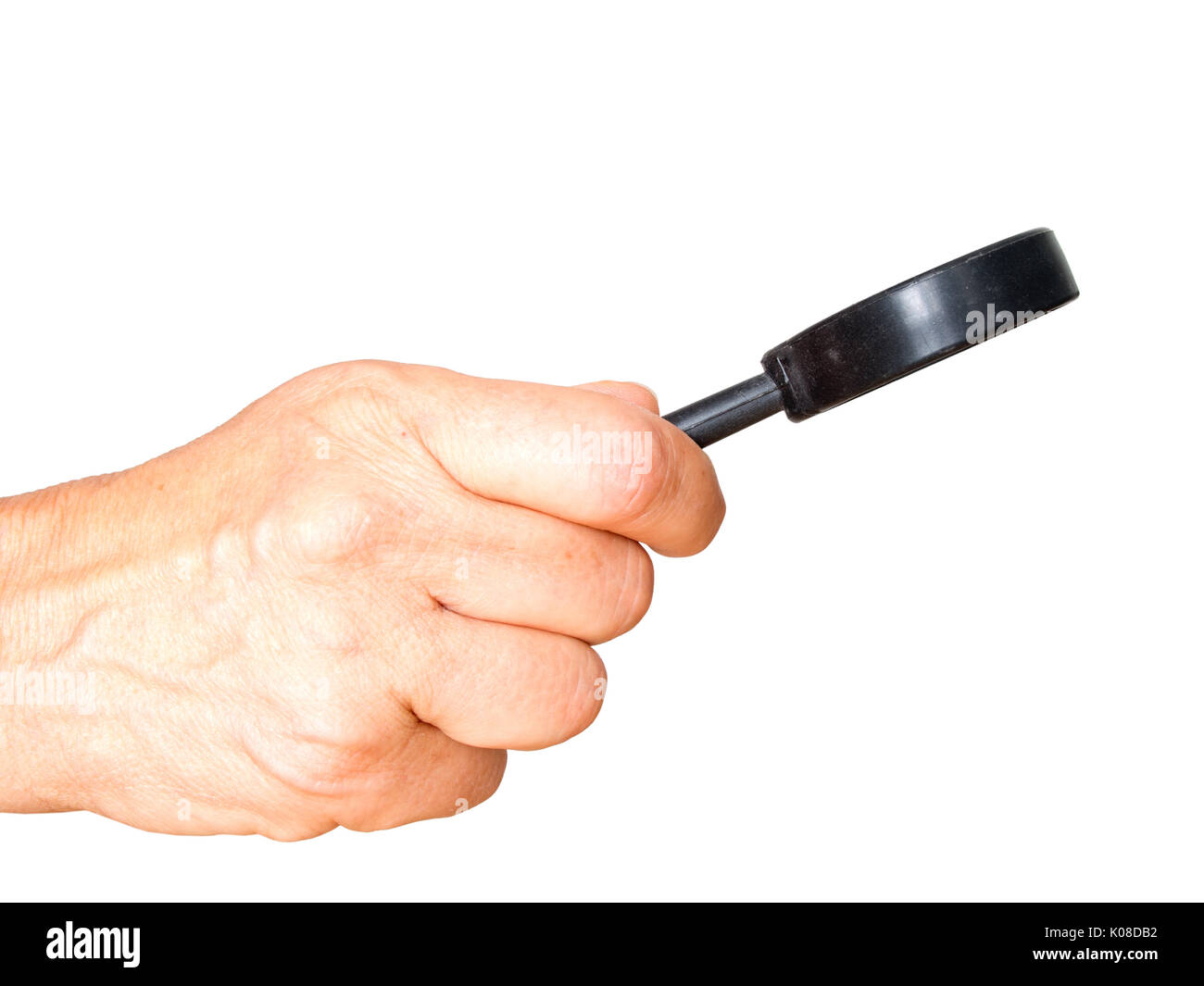 Mature hand with magnifying glass. Side view Stock Photo - Alamy