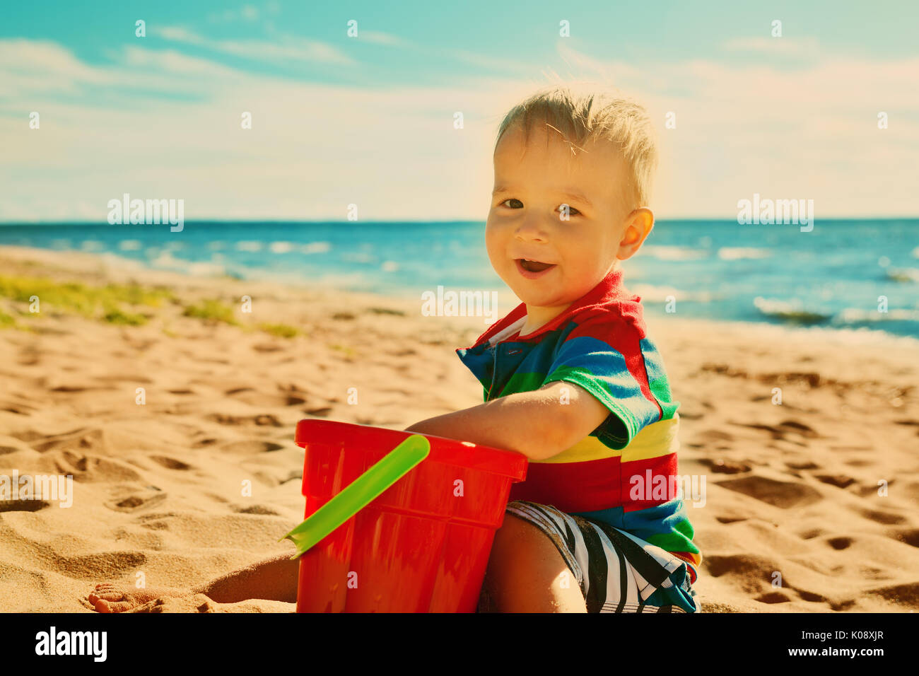 little boy smiling at the beach Stock Photo - Alamy