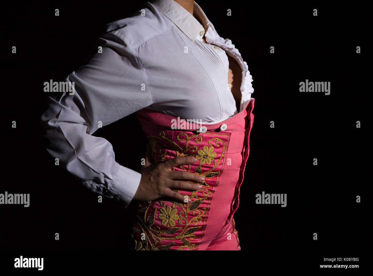 Woman bullfighter by dressing with vest on your back on a black ...
