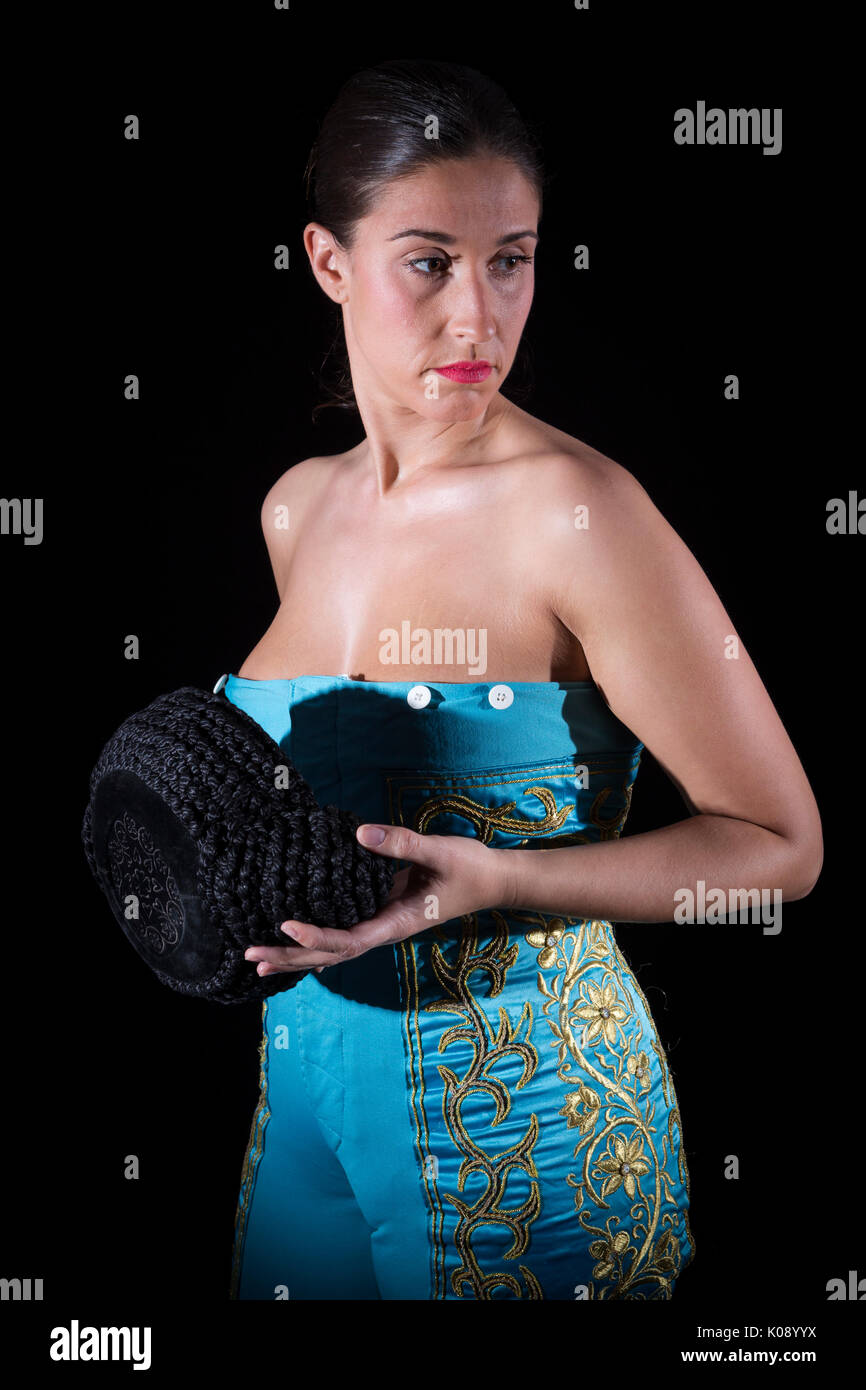 Woman bullfighter by dressing with vest on a black background Stock ...