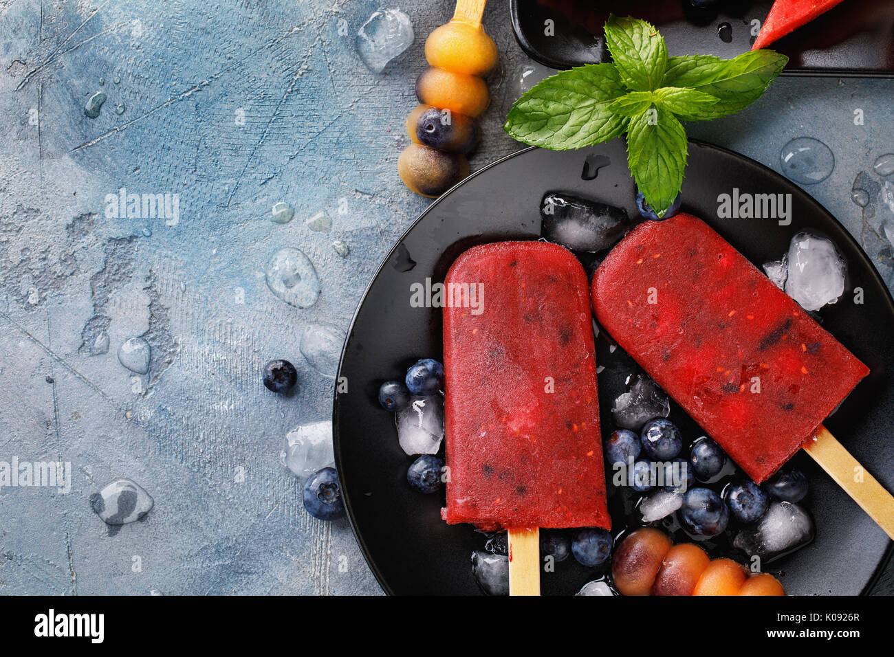 Fruit ice from watermelon, orange and blueberries with mint leaves. Top ...