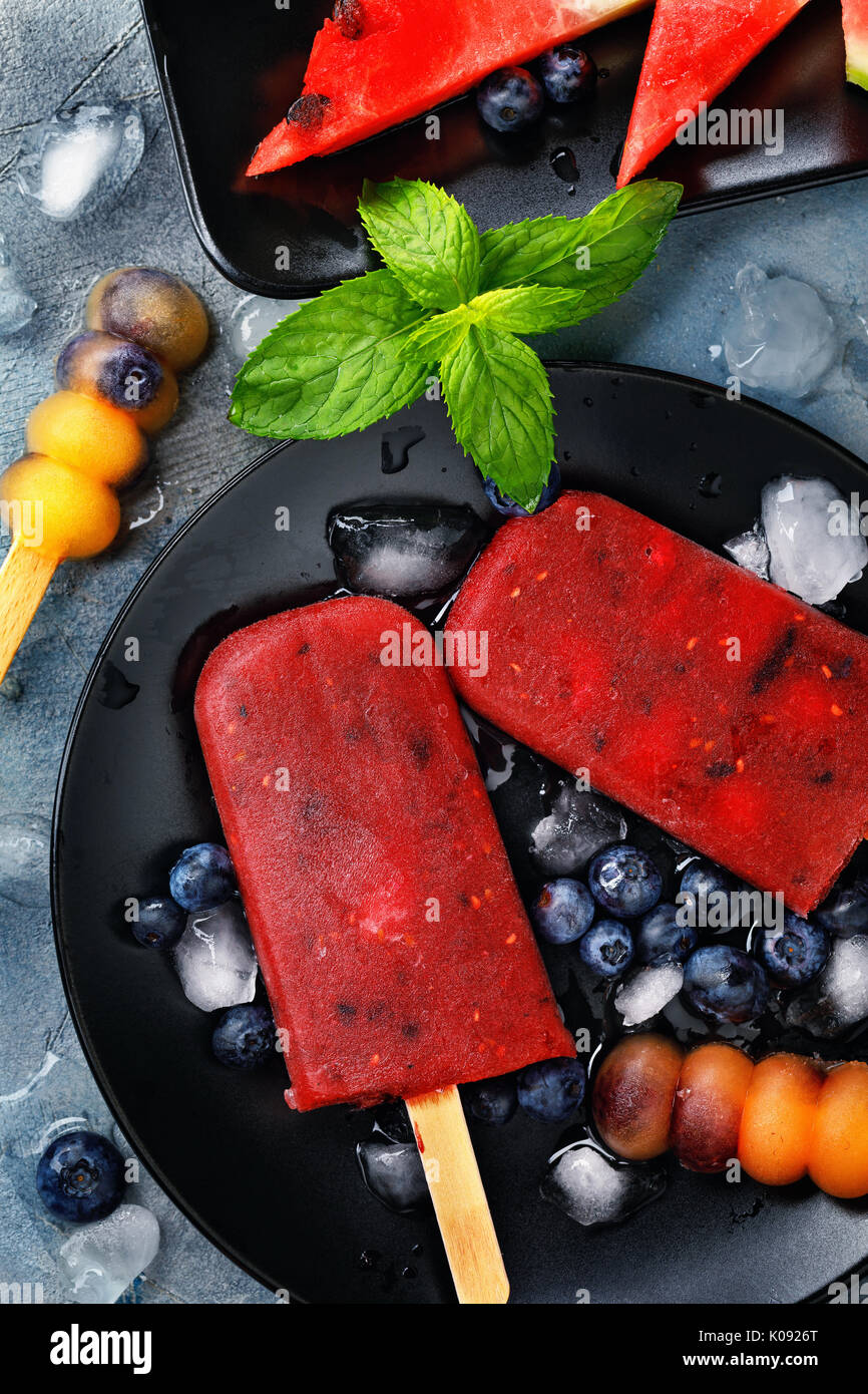 Fruit ice from watermelon, orange and blueberries with mint leaves. Top ...