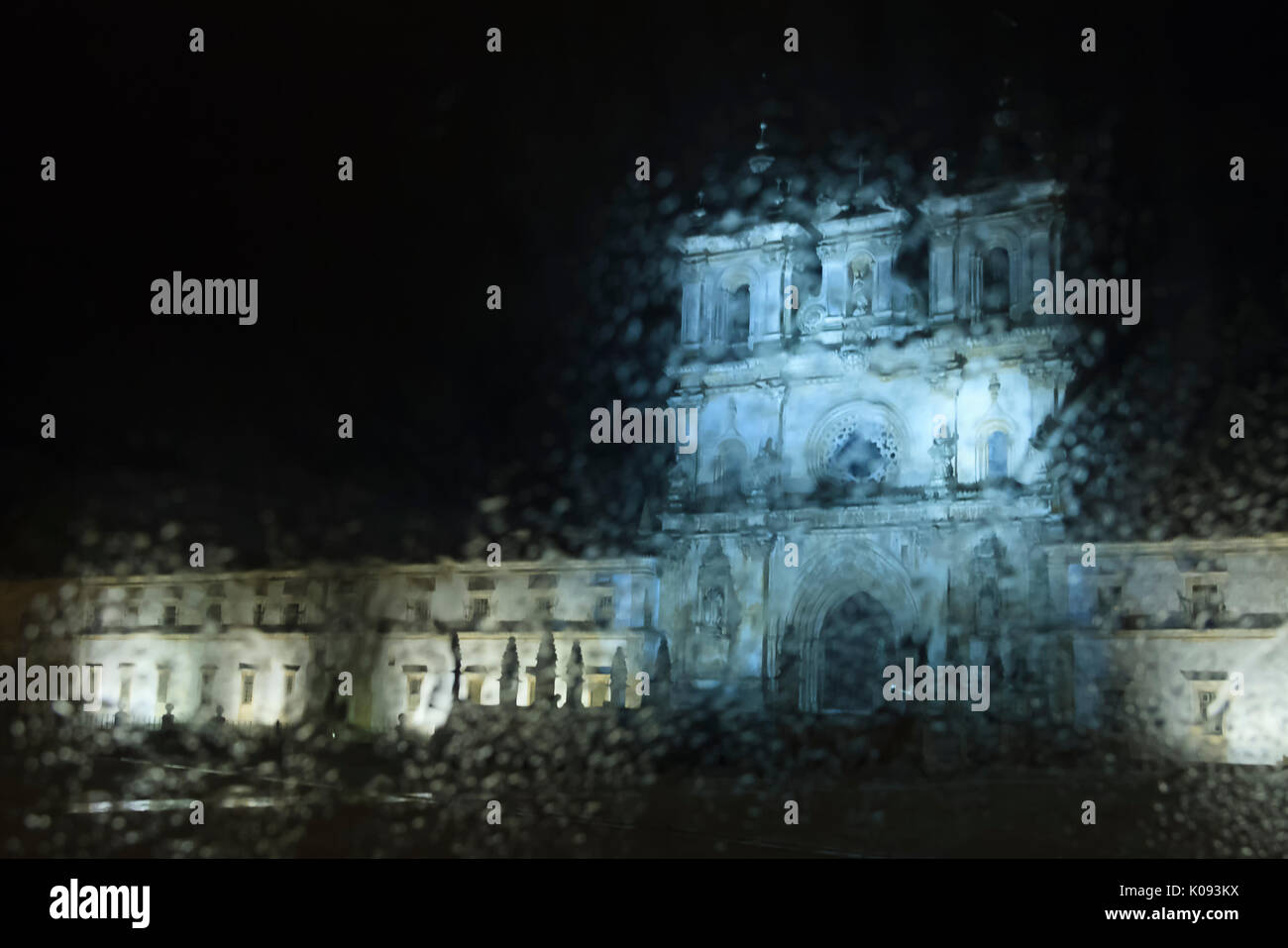 Facade of the Monastery of Alcobaca seen thru a car window glass in the ...