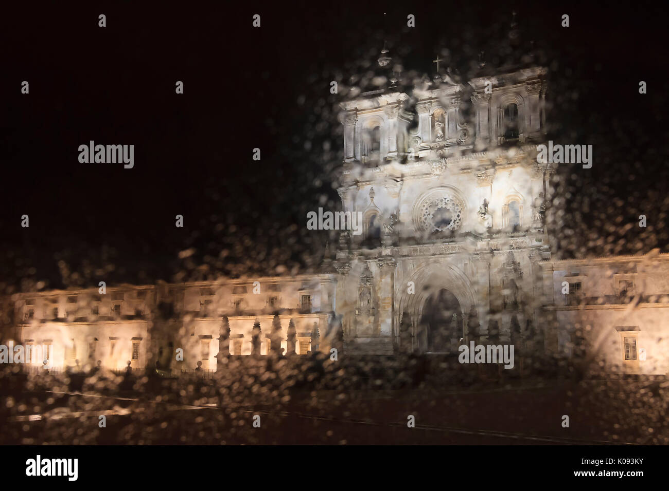 Facade of the Monastery of Alcobaca seen thru a car window glass in the ...