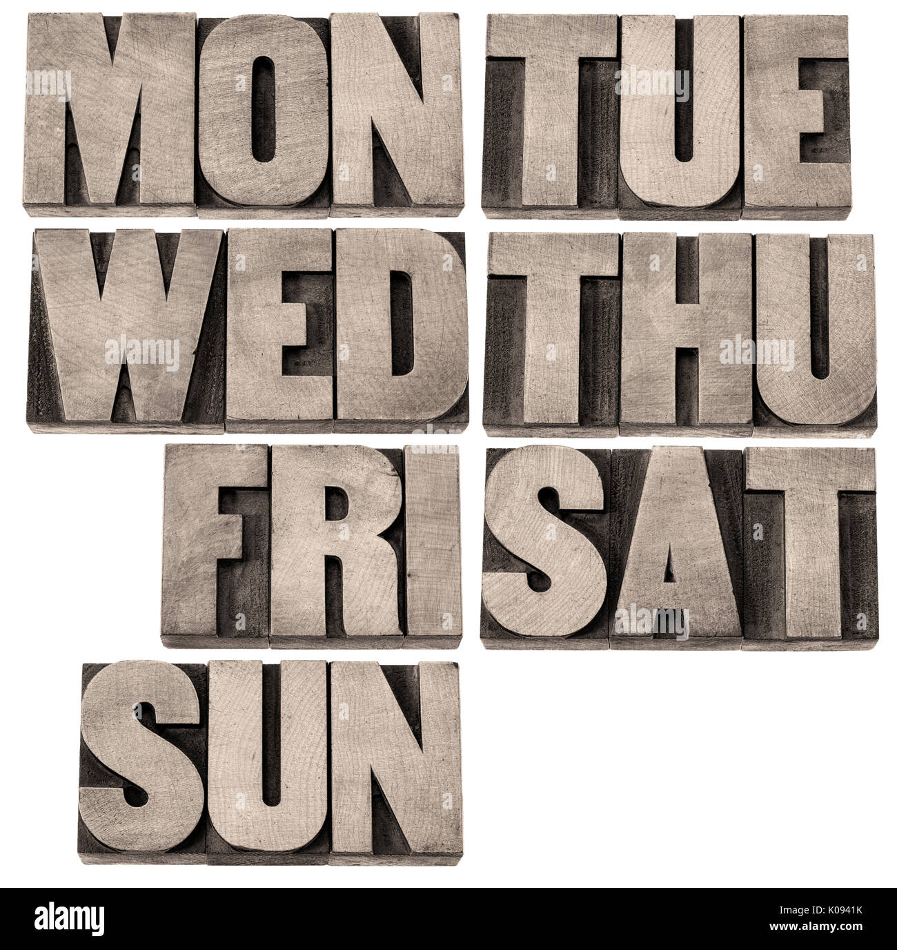 7 days of week (first 3 letter symbols) in isolated vintage wood ...