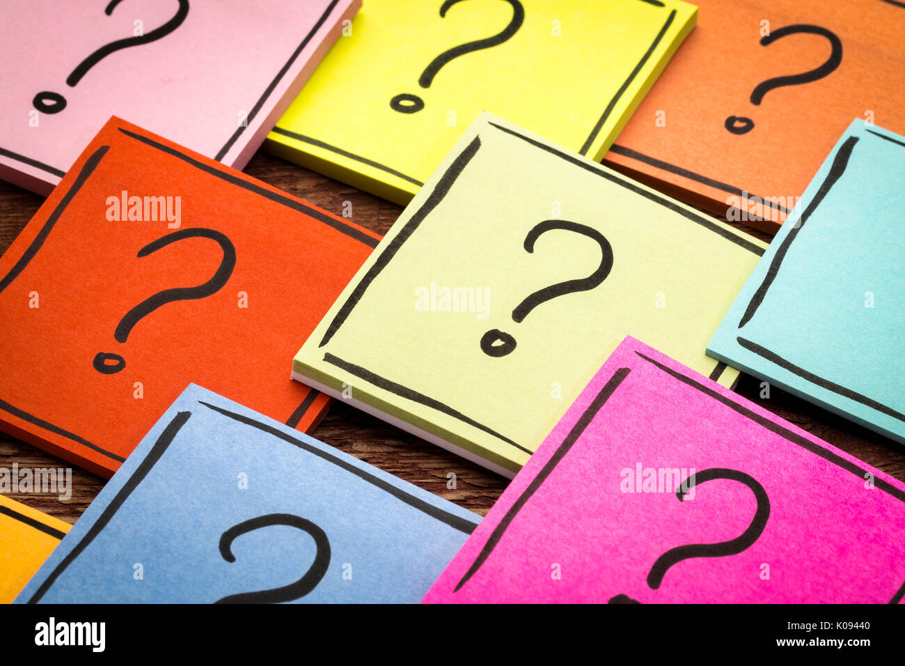 question mark concept - handwriting in black ink on colorful sticky ...