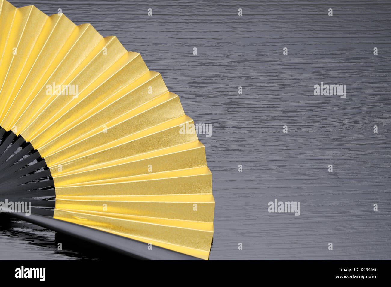 traditional chinese style golden hand fan on gray background Stock ...