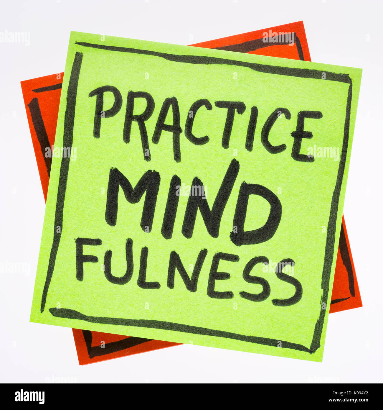 Practice mindfulness reminder - handwriting on an isolated sticky note ...