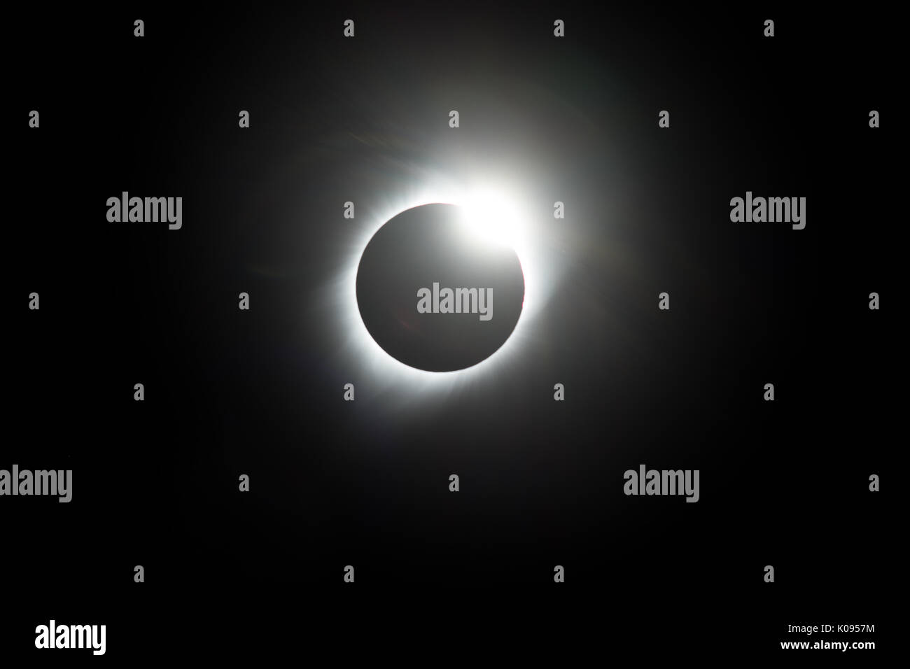 As the sun shines through the valleys of the moon a bright diamond ring ...