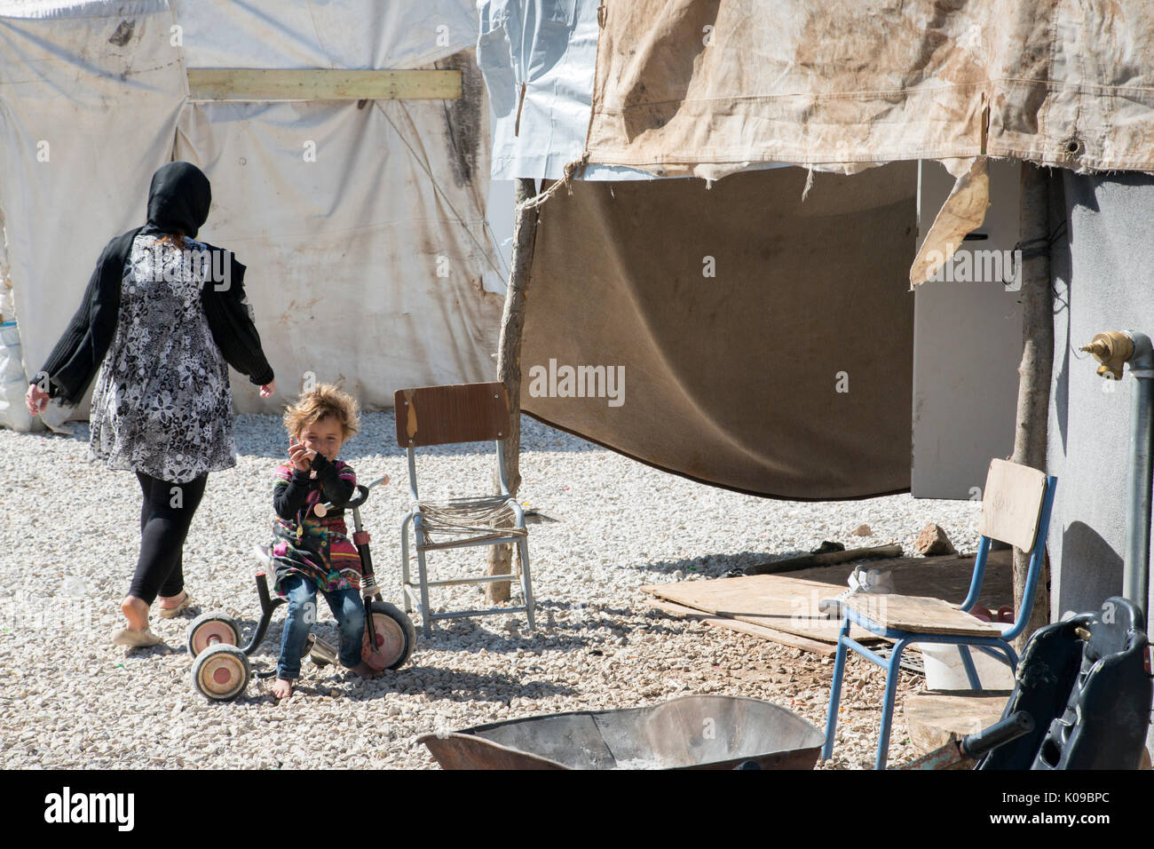 Smiling syrian refugee children in camp hi-res stock photography and ...