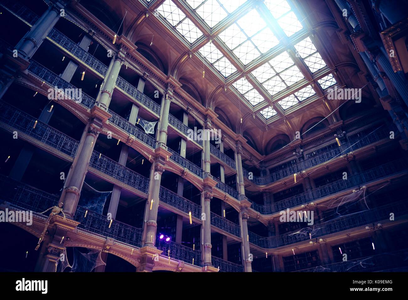 Low camera angle of the George Peabody Library with sunlight shining ...