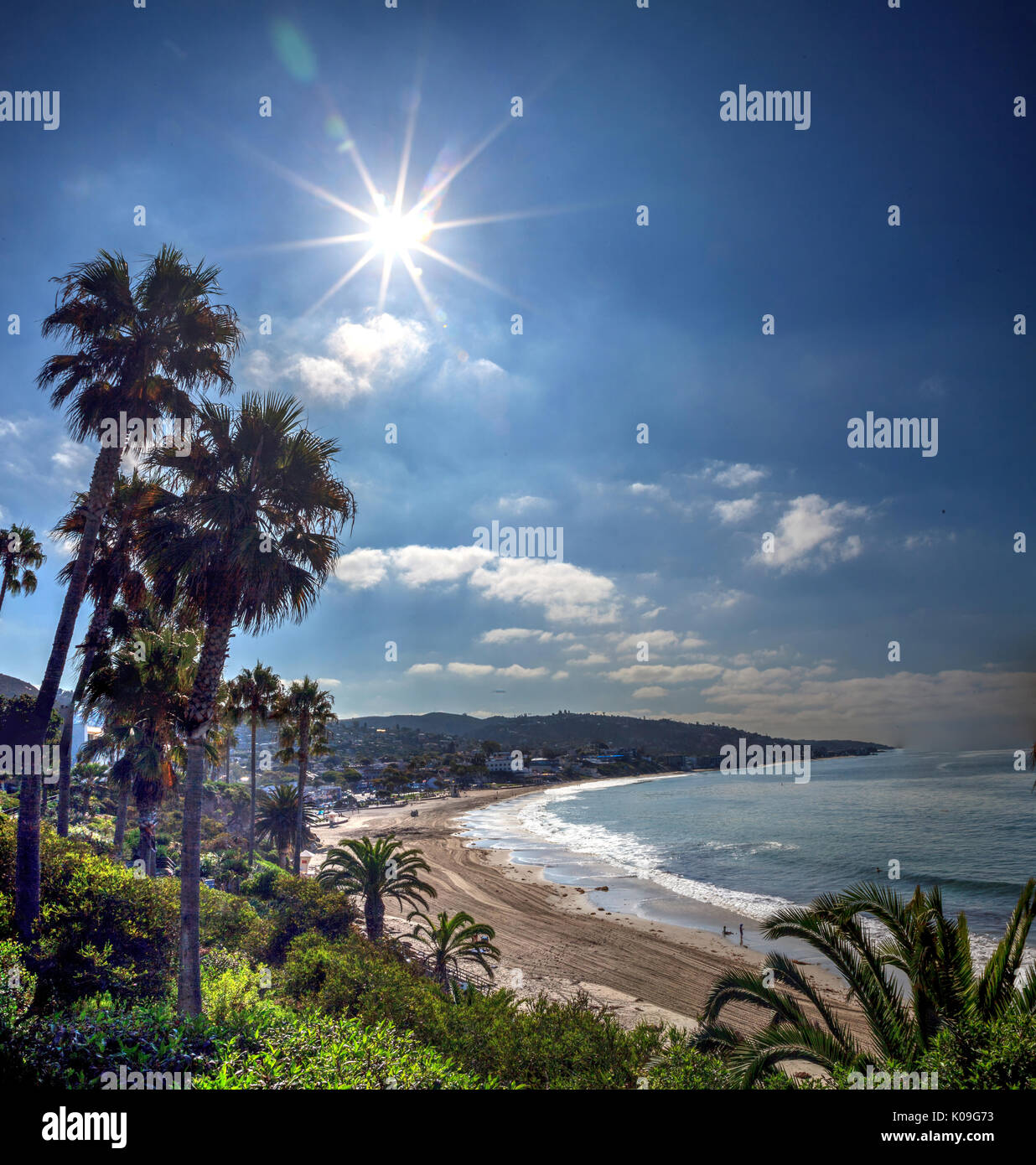 View of the sun over Main Beach, Laguna Beach, California right before ...