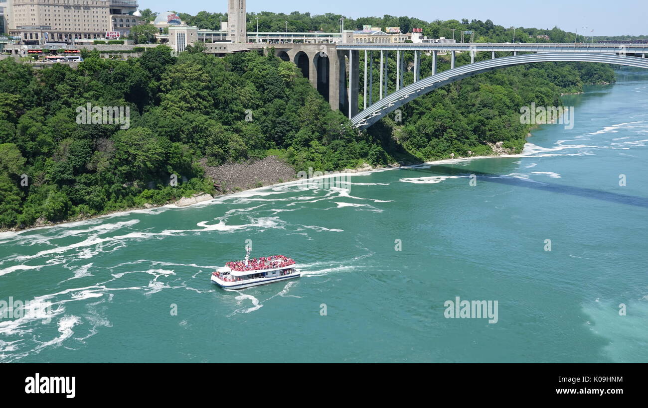 Passenger Ferry In River And Bridge Stock Photo - Alamy