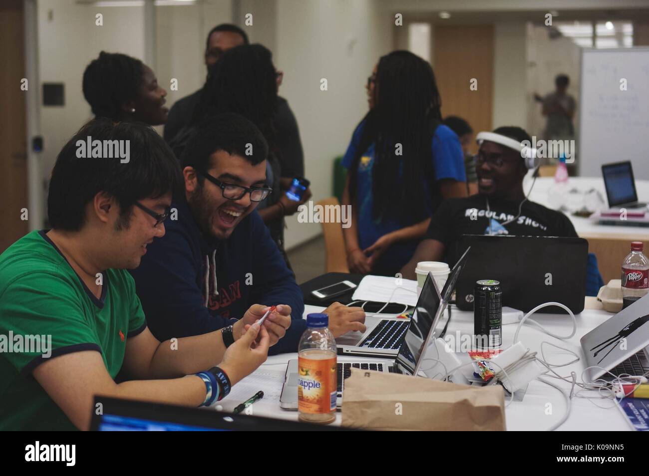 College students laugh and talk as they study in the Brody Learning ...