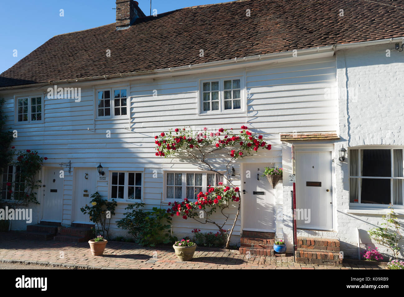 A white weatherboarded cottage in the village of Hartfield in East ...
