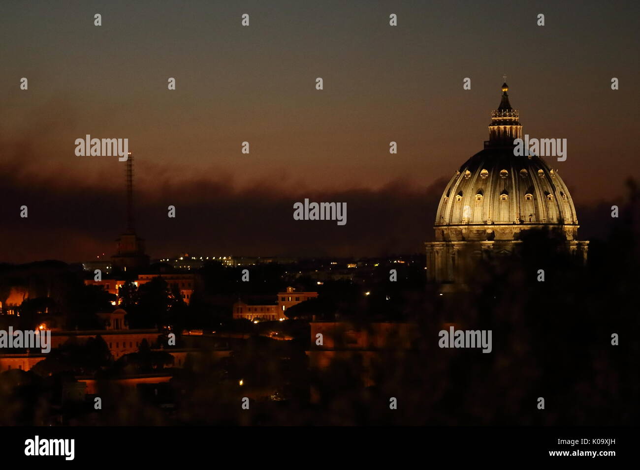 Rome, Italy. 21st Aug, 2017. Smoke of a fire blown by the wind behind ...