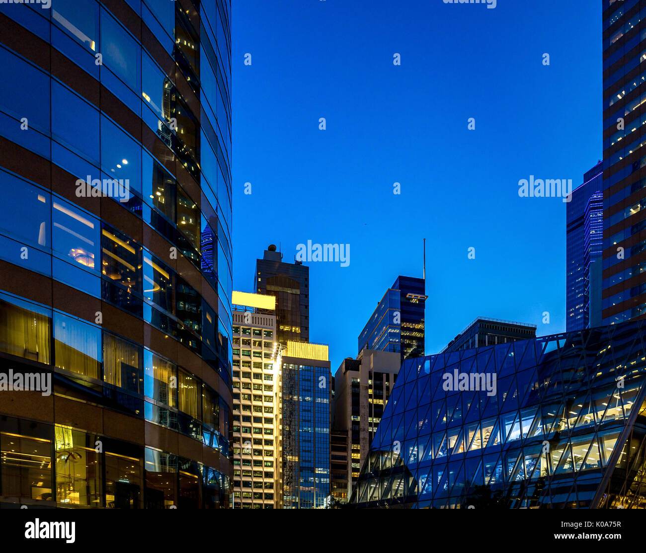 Commercial buildings at night in Hong Kong Stock Photo - Alamy