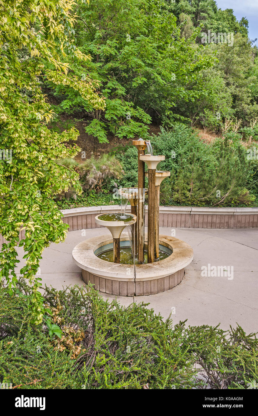 Rusty, old water fountain with water pouring from five levels Stock ...
