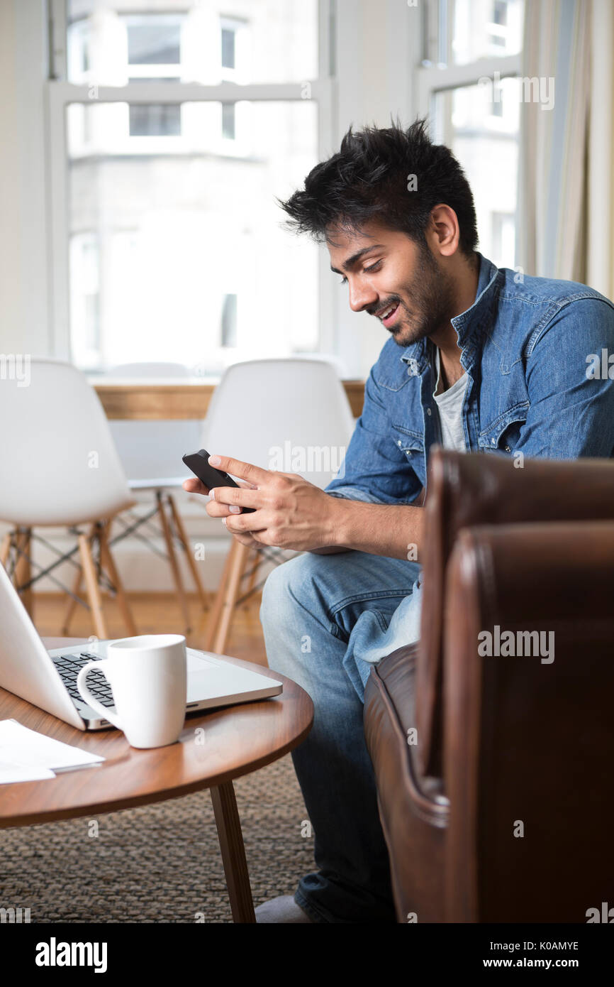 Indian work from home phone laptop hi-res stock photography and images ...