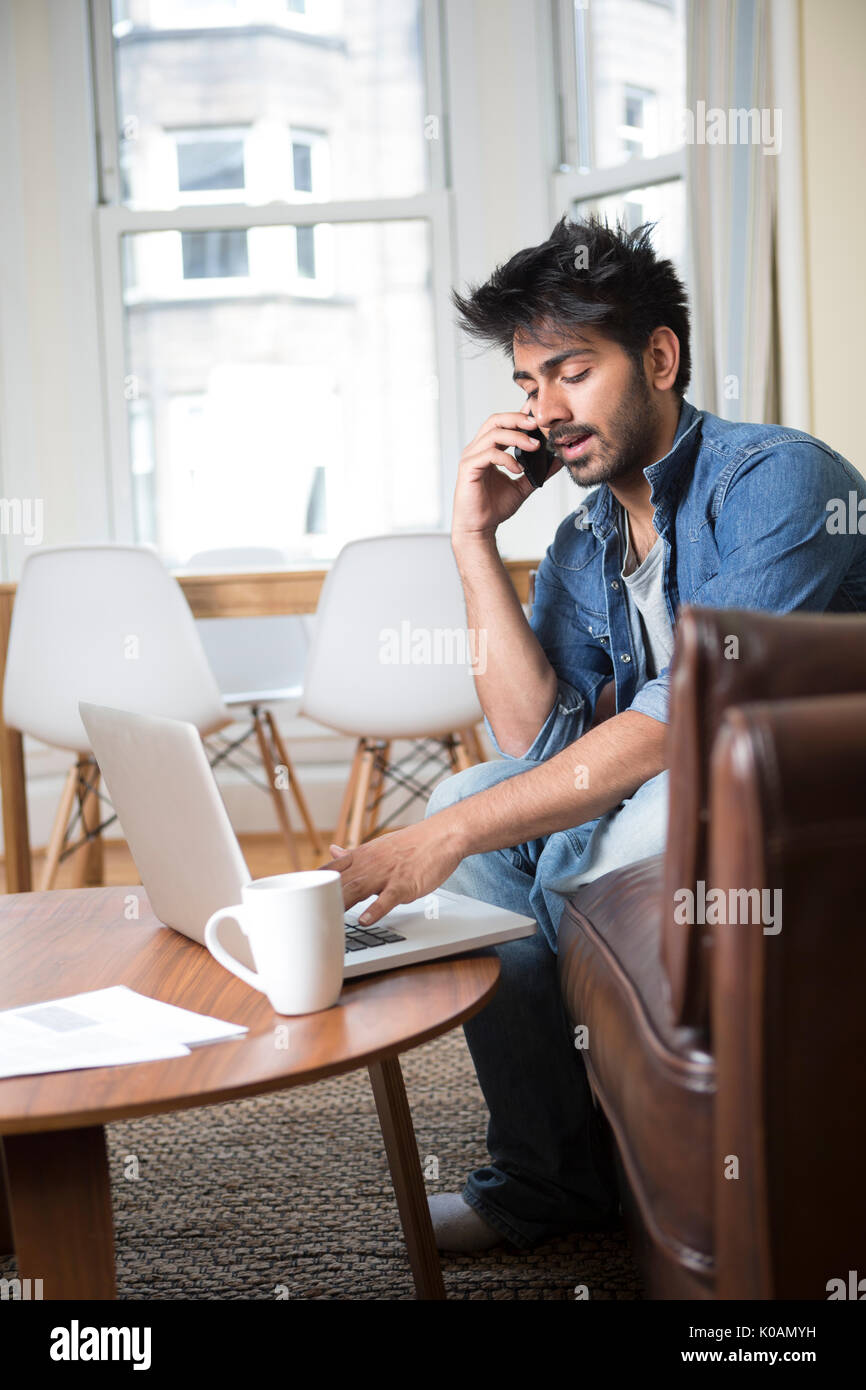 Indian work from home phone laptop hi-res stock photography and images ...