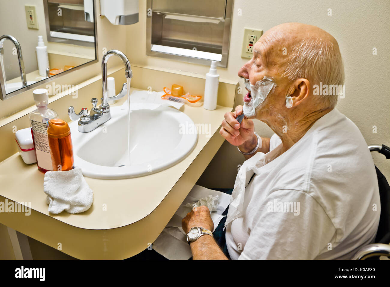 Elderly Male Patient in Wheelchair Shaving at Sink Stock Photo - Alamy